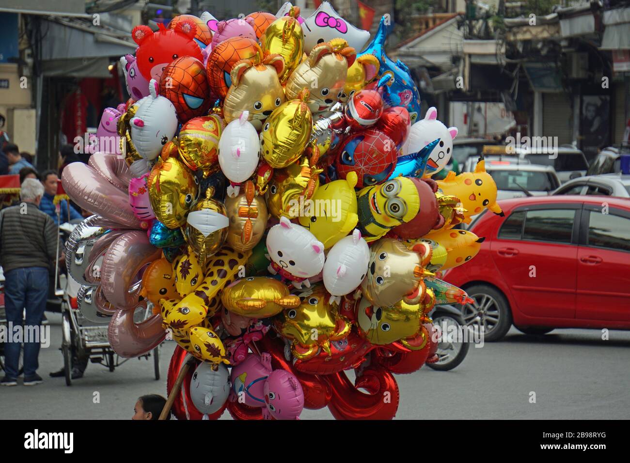 merchant selling colorful balloons in the streets of hanoi Stock Photo ...