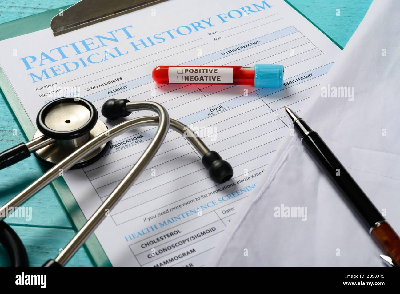 blood test tube with positive result and the patient history form the X ...