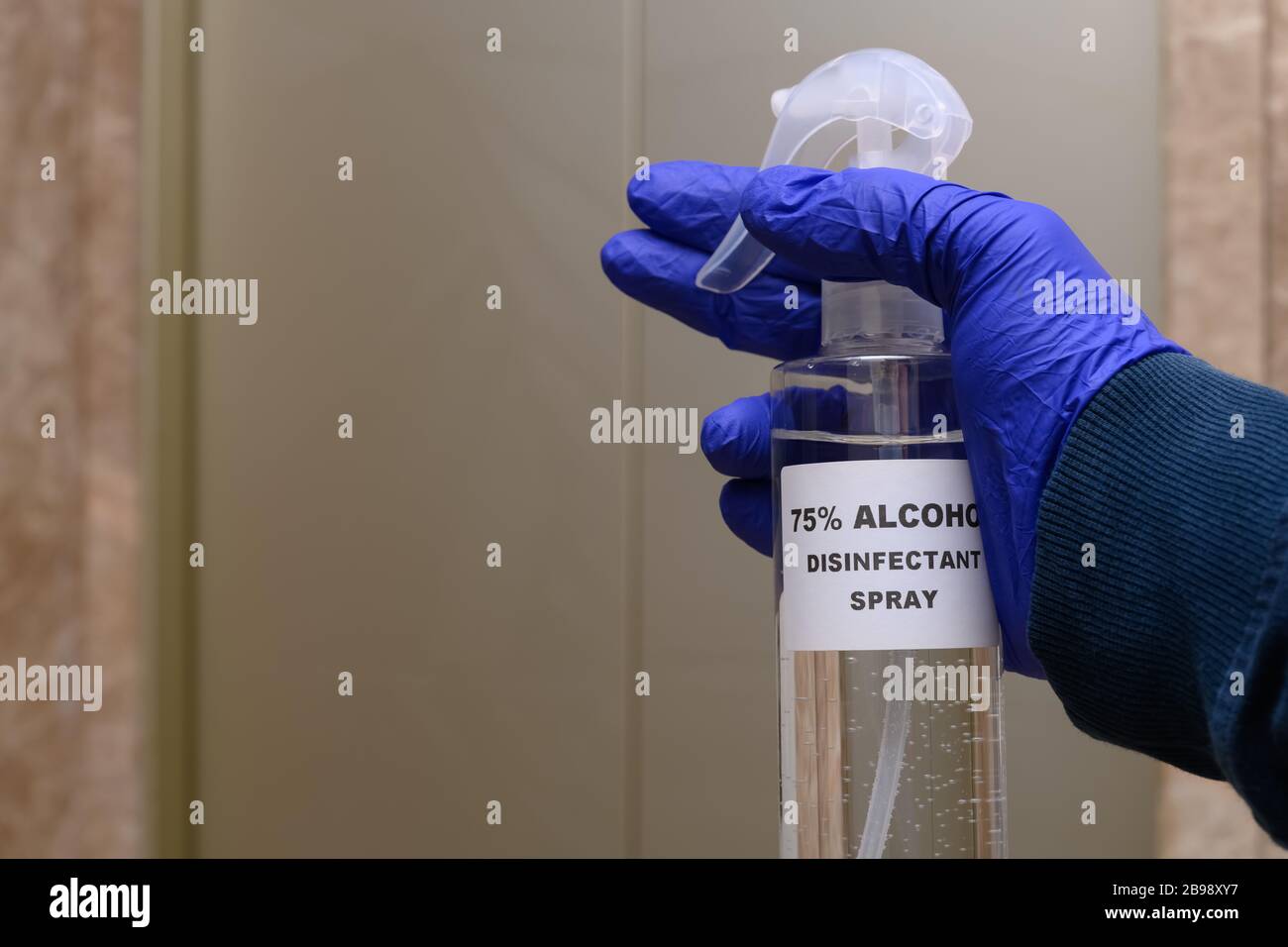 75 percent alcohol disinfectant spray in front of a lift Stock Photo ...
