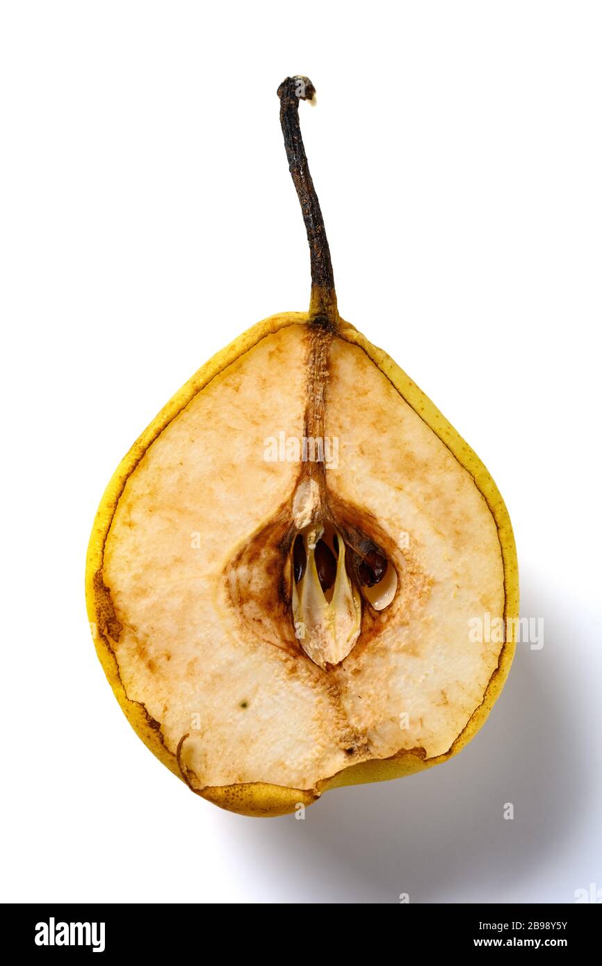 cut out section of an overripe pear on white background Stock Photo - Alamy