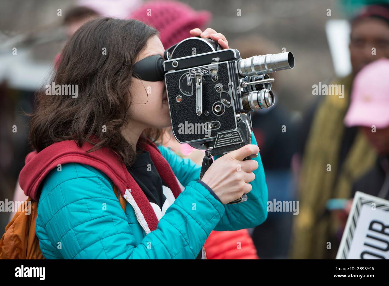 Woman taking video with vintage camera Stock Photo - Alamy