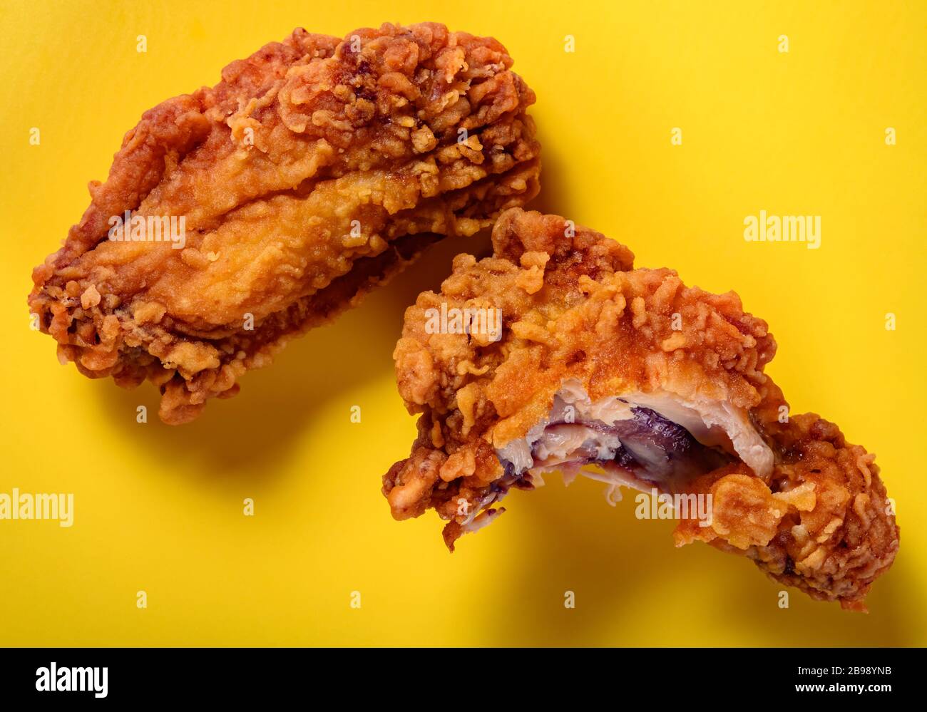 top view fresh deep fried chicken drumstick and wing with a bite on ...