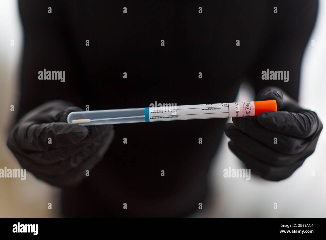 Corona virus Covid-19 respiratory sputum specimen swab test tube with ...