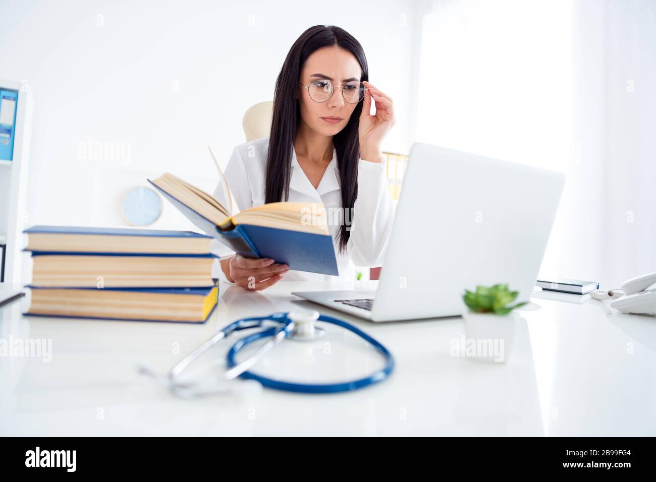 Photo of pretty professional doc lady hold science literature ...