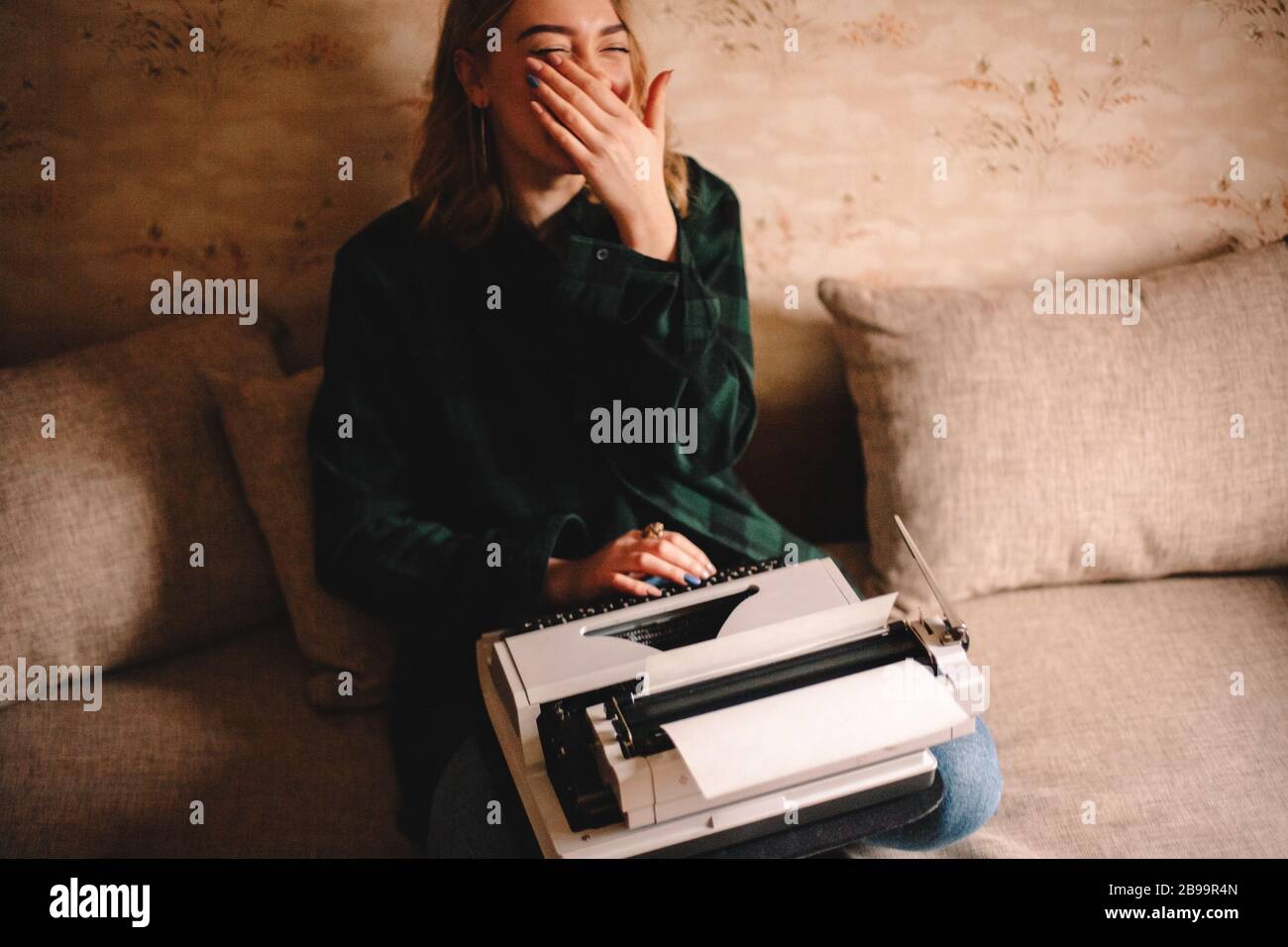 Laughing couch female hi-res stock photography and images - Alamy