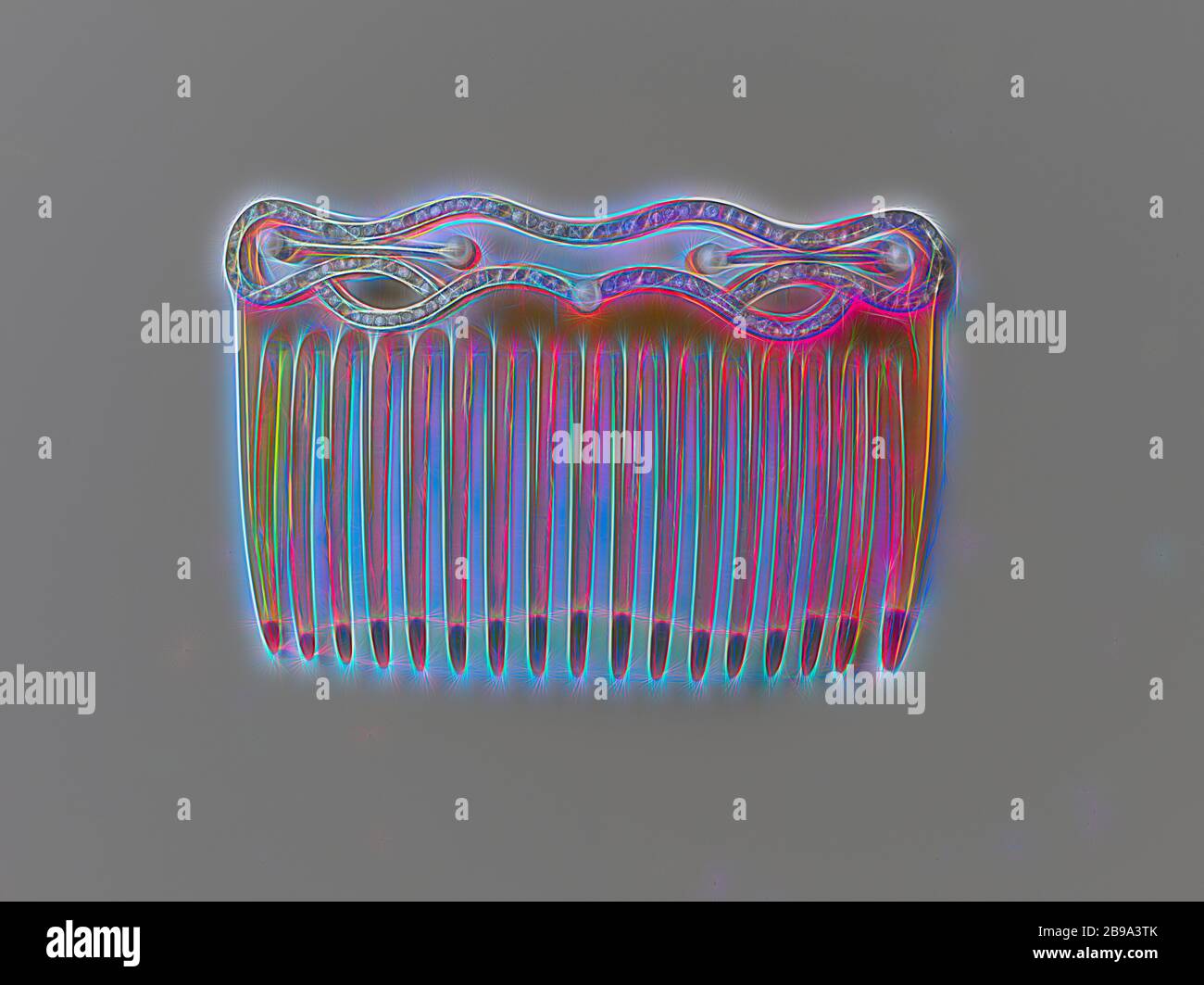 Hair comb made of plastic, with a spine on which pearls and rhinestones ...