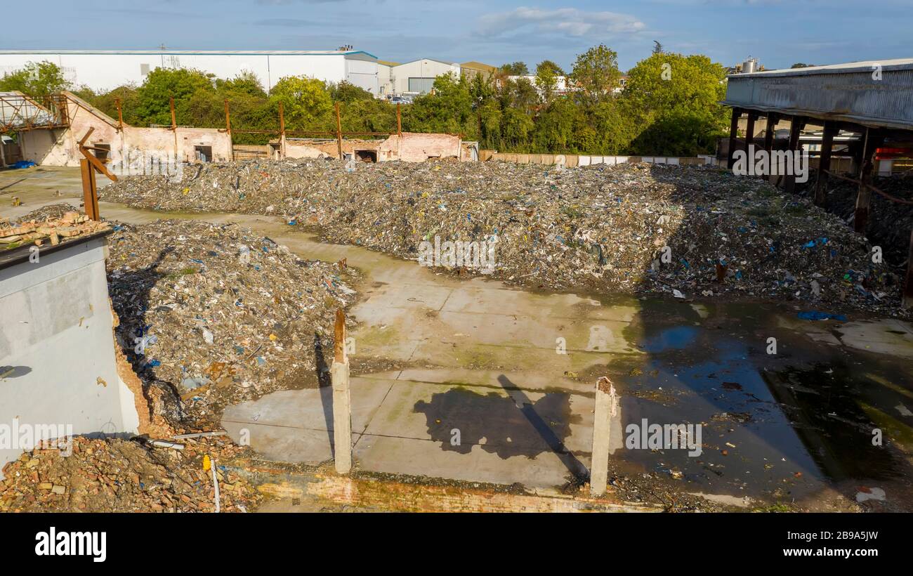 Aerial view of a warehouse destroyed by fire and filled with waste ...