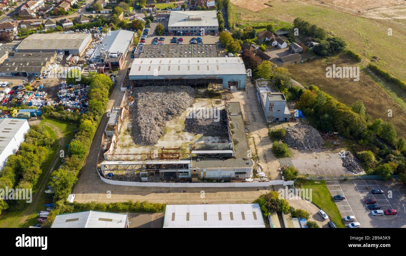 Aerial view of a warehouse destroyed by fire and filled with waste ...
