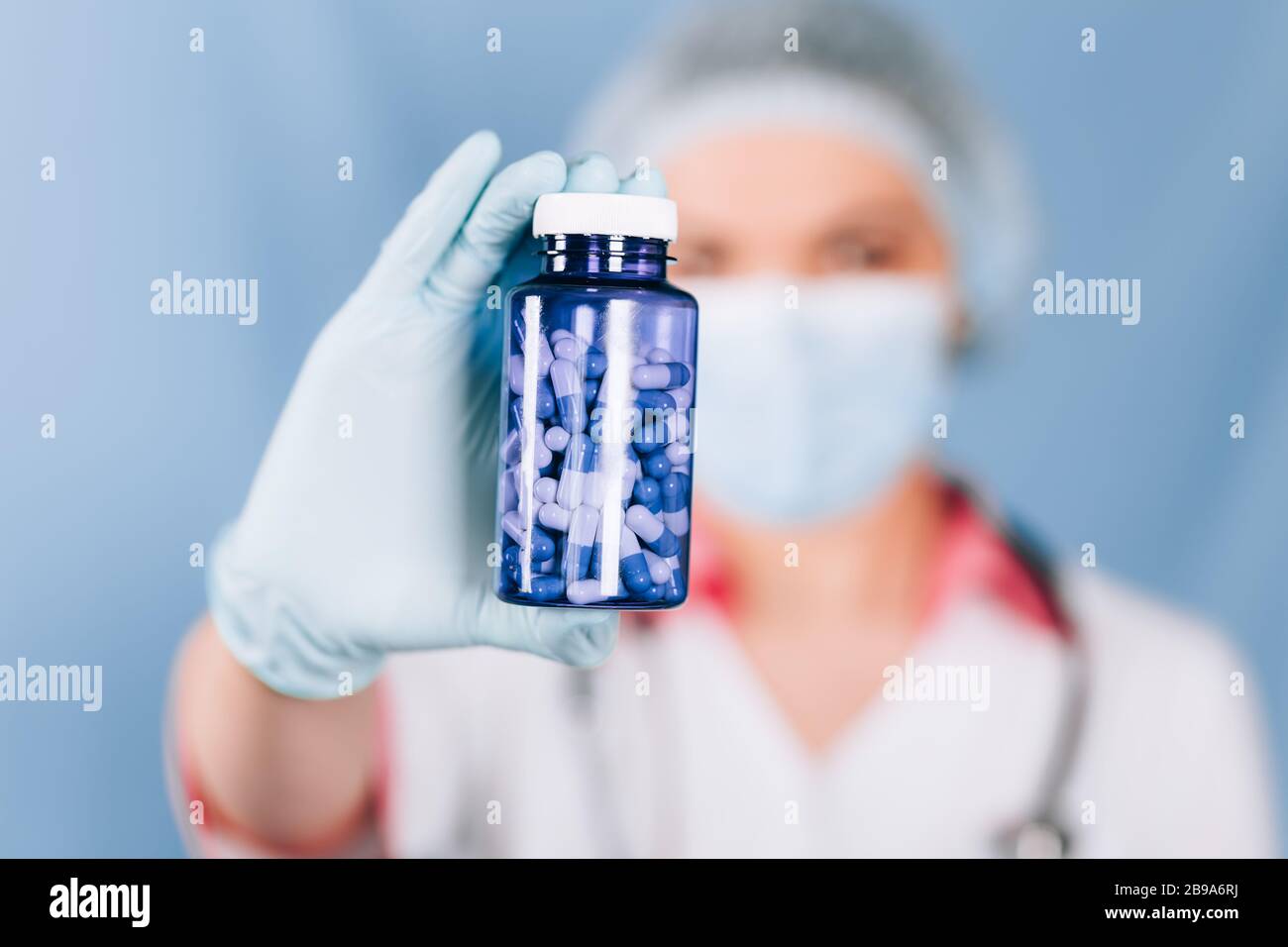 doctor holding medication Stock Photo - Alamy