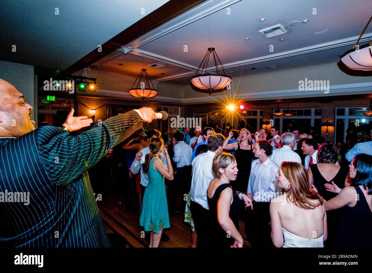 Entertainer singing at a night party Stock Photo - Alamy