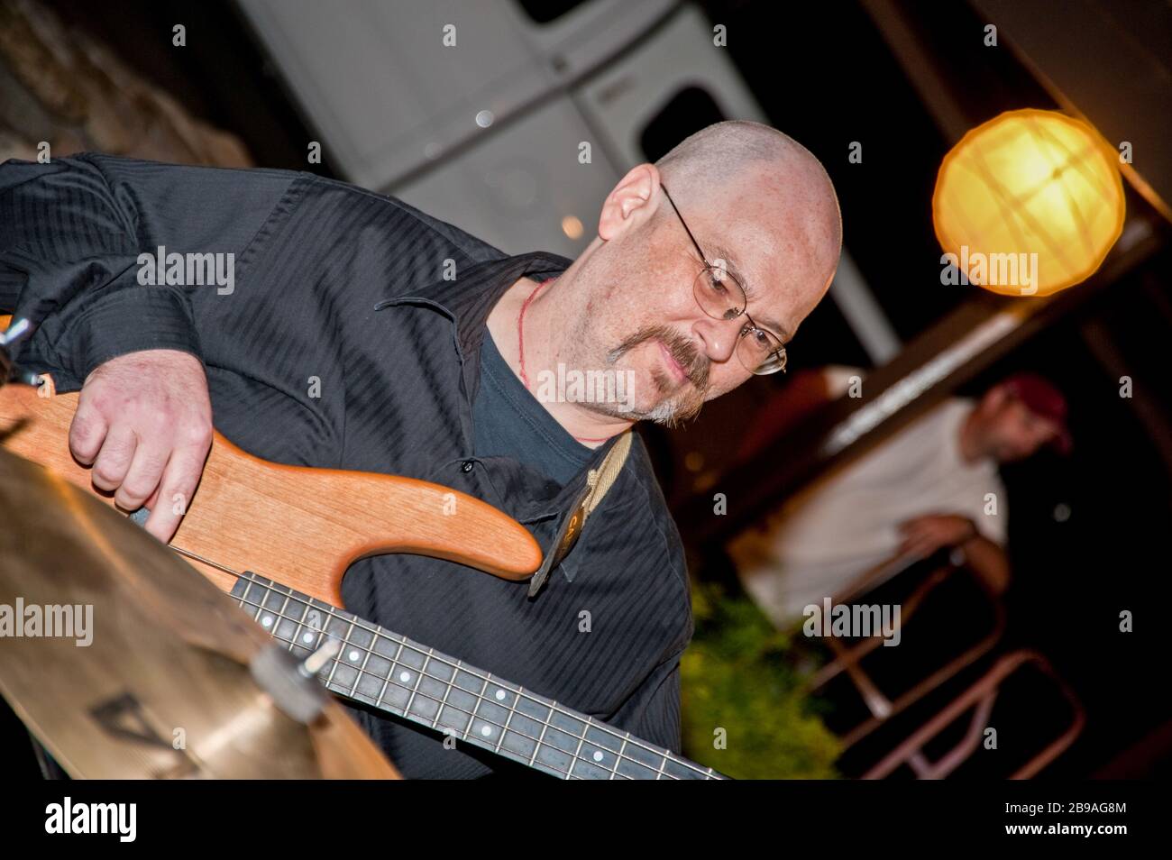Entertainer singing at a night party Stock Photo - Alamy