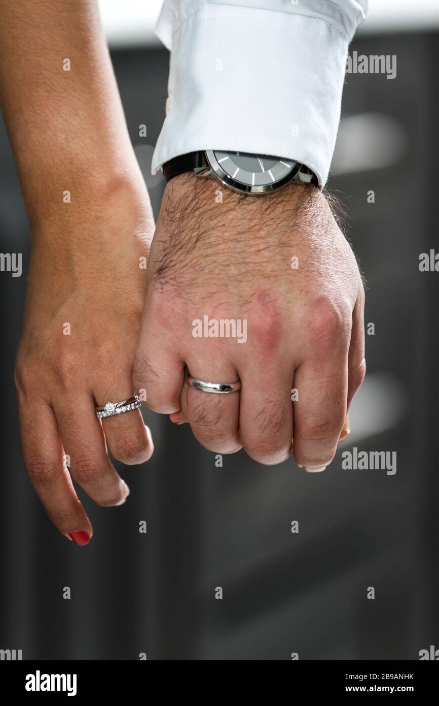 Wearing wedding bands hi-res stock photography and images - Alamy