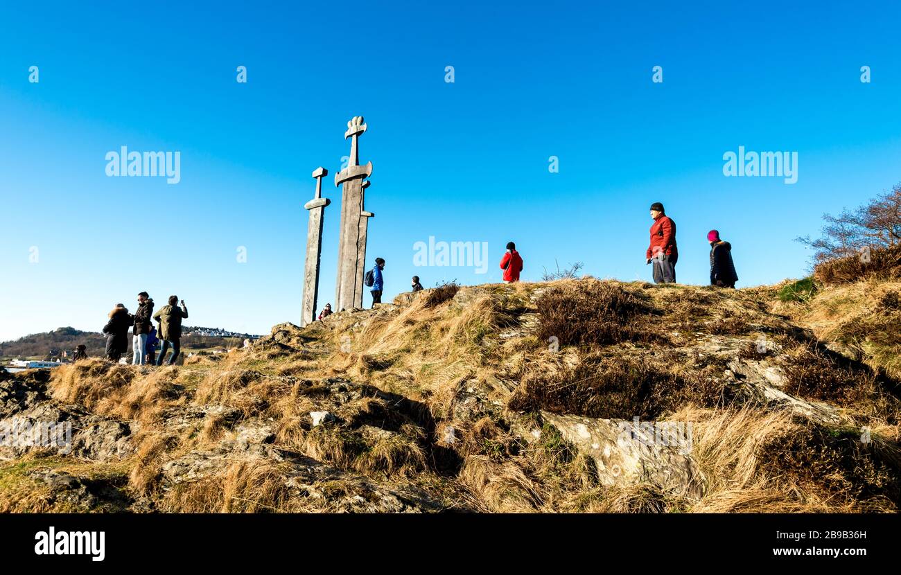 Tourists enjoy sea views and take pictures of the Sword in Rock ...