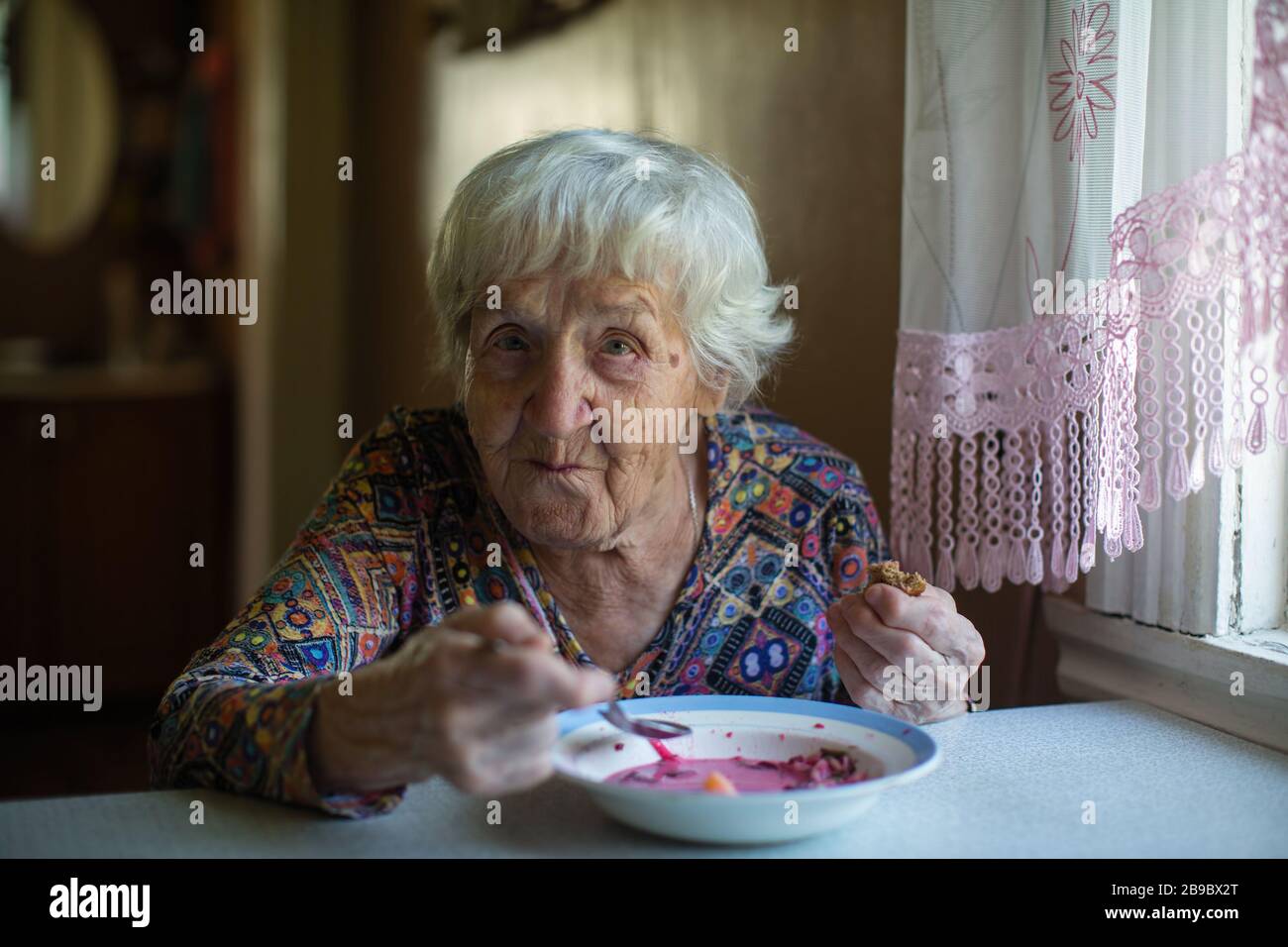 Woman senior eating soup hi-res stock photography and images - Alamy