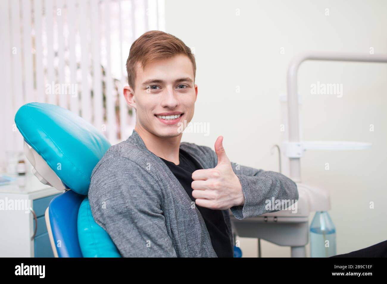 Dentistry. Dentist and patient. Dental clinic. Patient thumbs up Stock ...