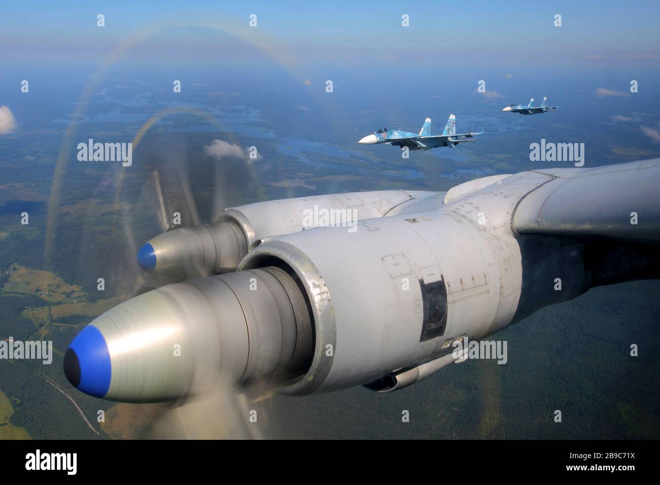Tu-142MZ airplane in formation with Su-33 jet fighters of the Russian ...