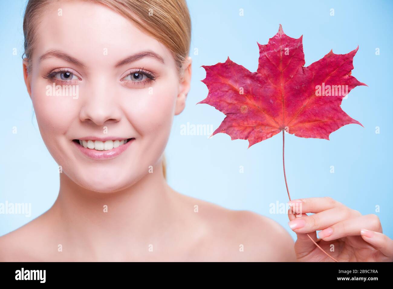 Skincare habits. Portrait of young woman with leaf as symbol of red ...