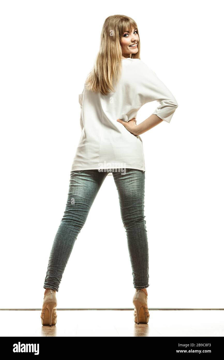 Fashion. Woman full length in denim trousers high heels shoes casual ...