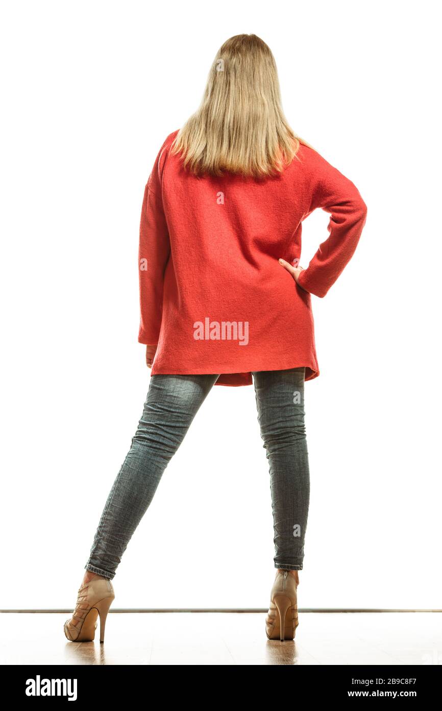 Fashion. Full body blonde fashionable woman in vivid color red coat ...