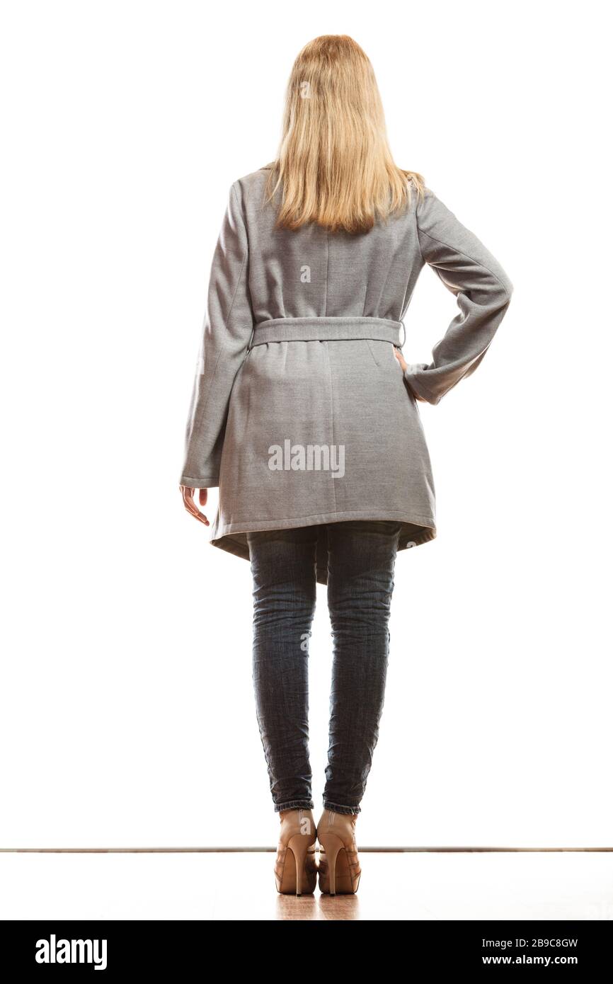 Fashion. Young blonde fashionable woman in elegant gray belt coat ...