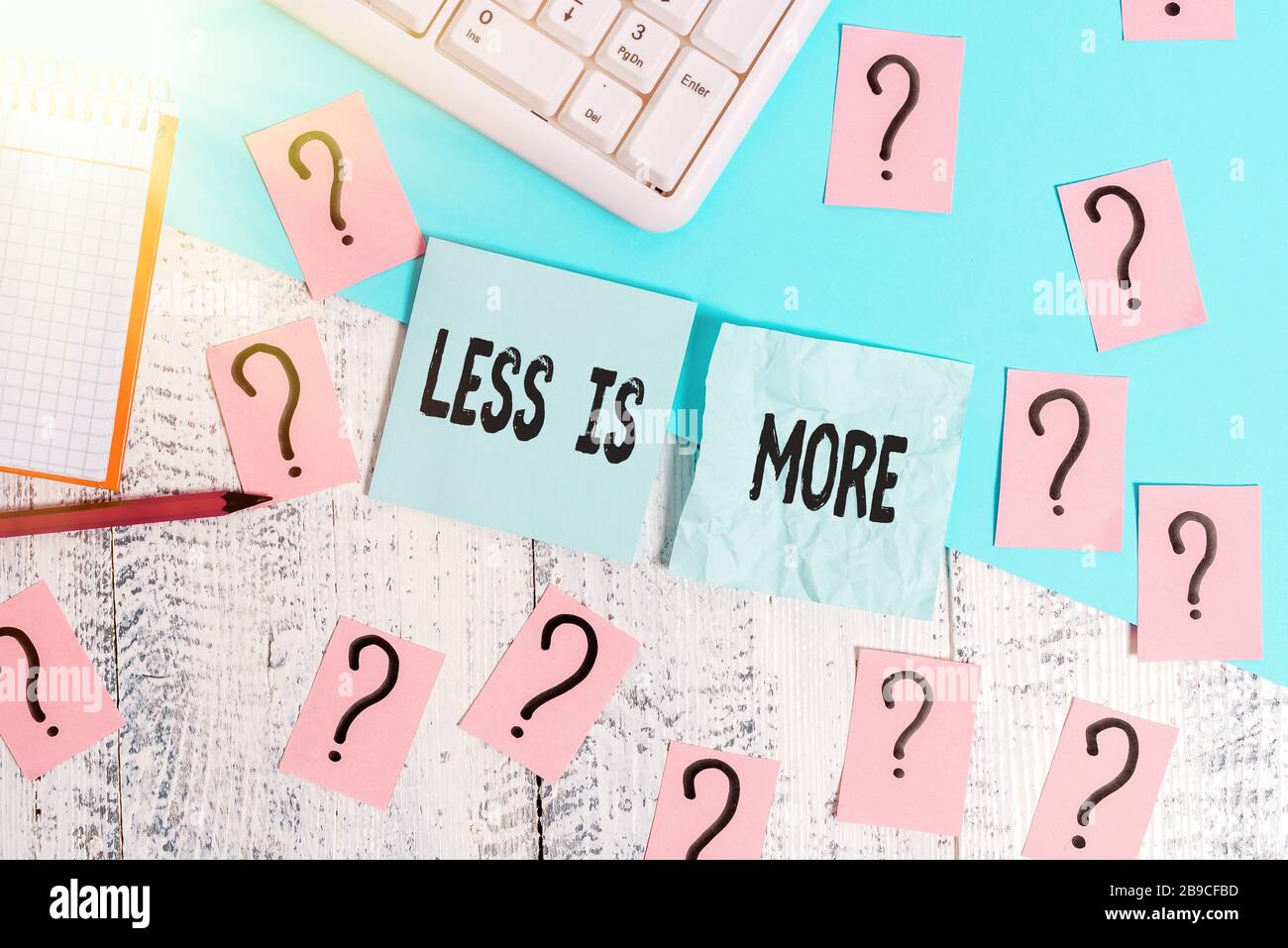 Writing note showing Less Is More. Business concept for used to express ...