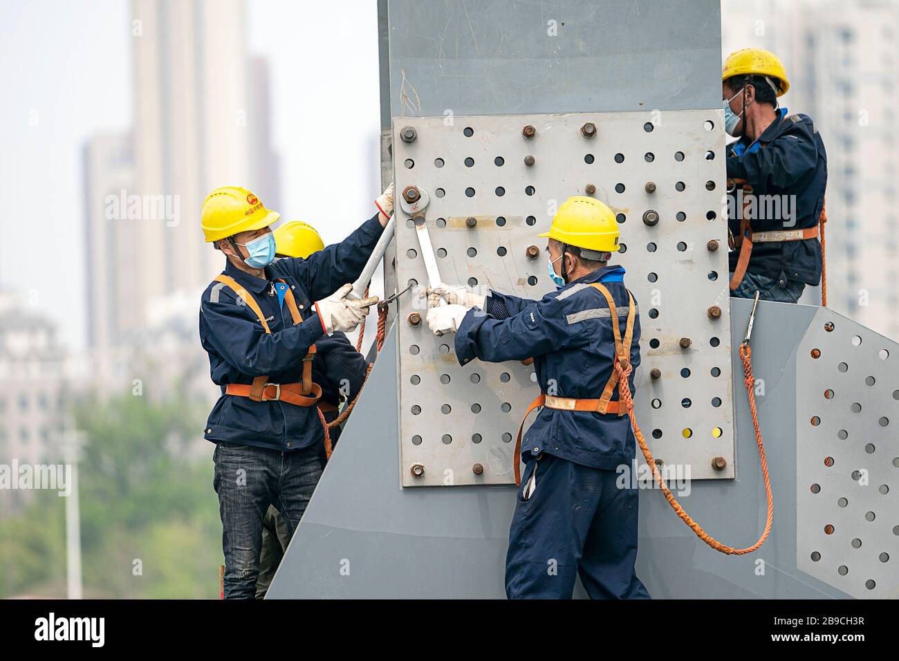 Wuhan, China's Hubei Province. 24th Mar, 2020. Workers work at the ...