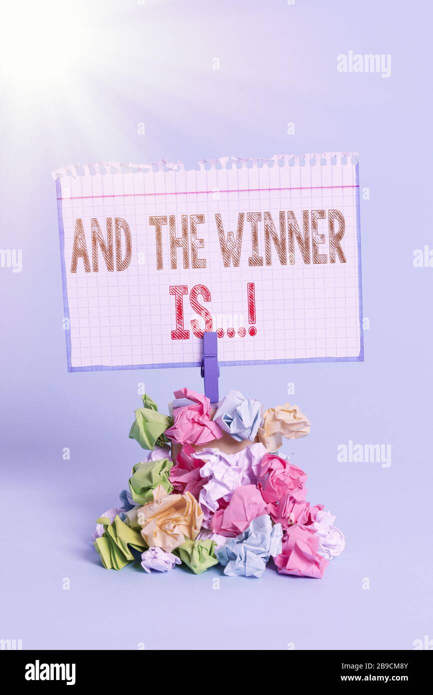 Handwriting text writing And The Winner Is. Conceptual photo announcing ...
