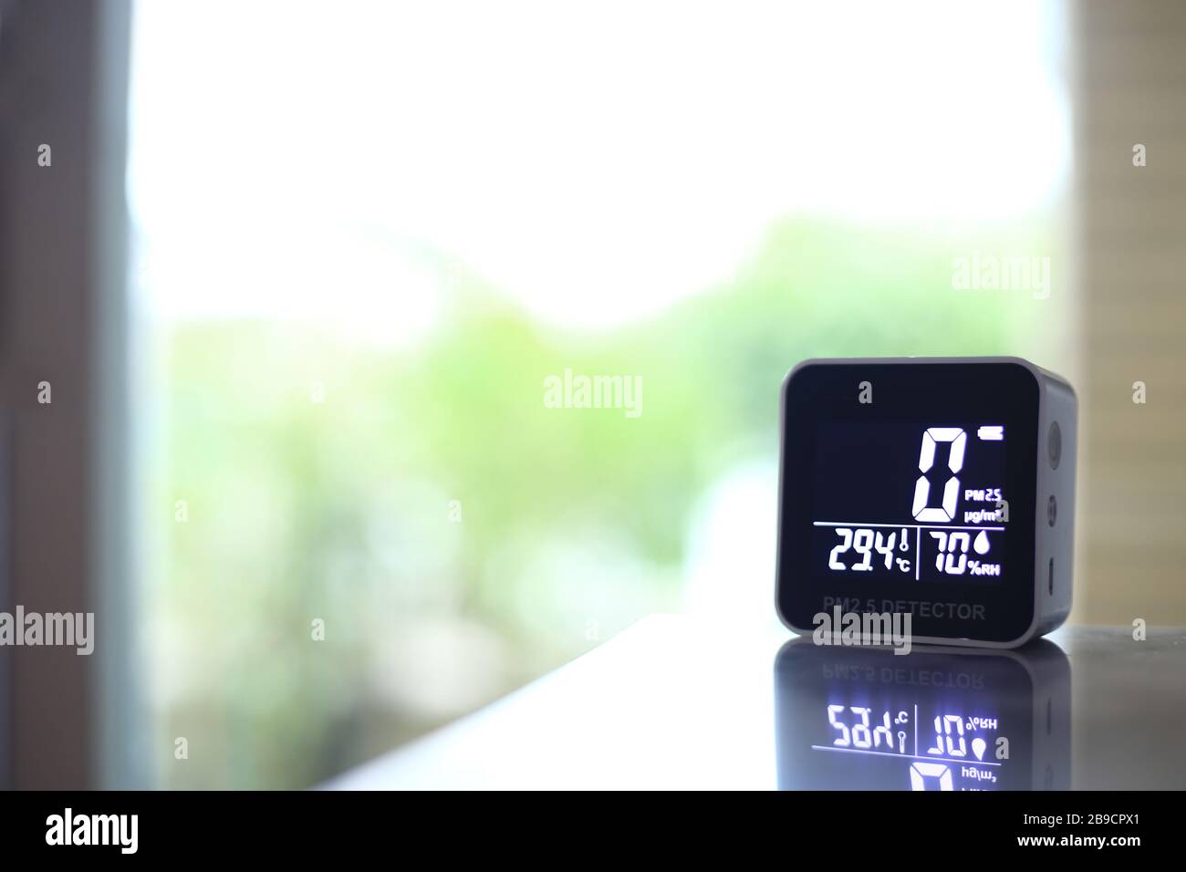 air quality sensor placing on a table indoor. sensor found small amount ...