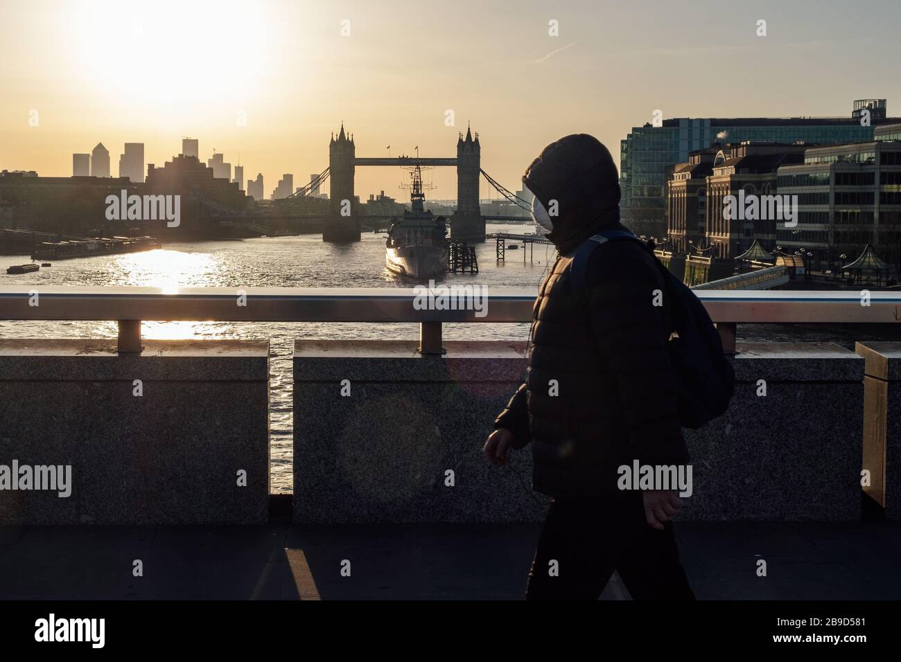 London Bridge, London, UK. 24th Mar, 2020. People with facemasks walk ...
