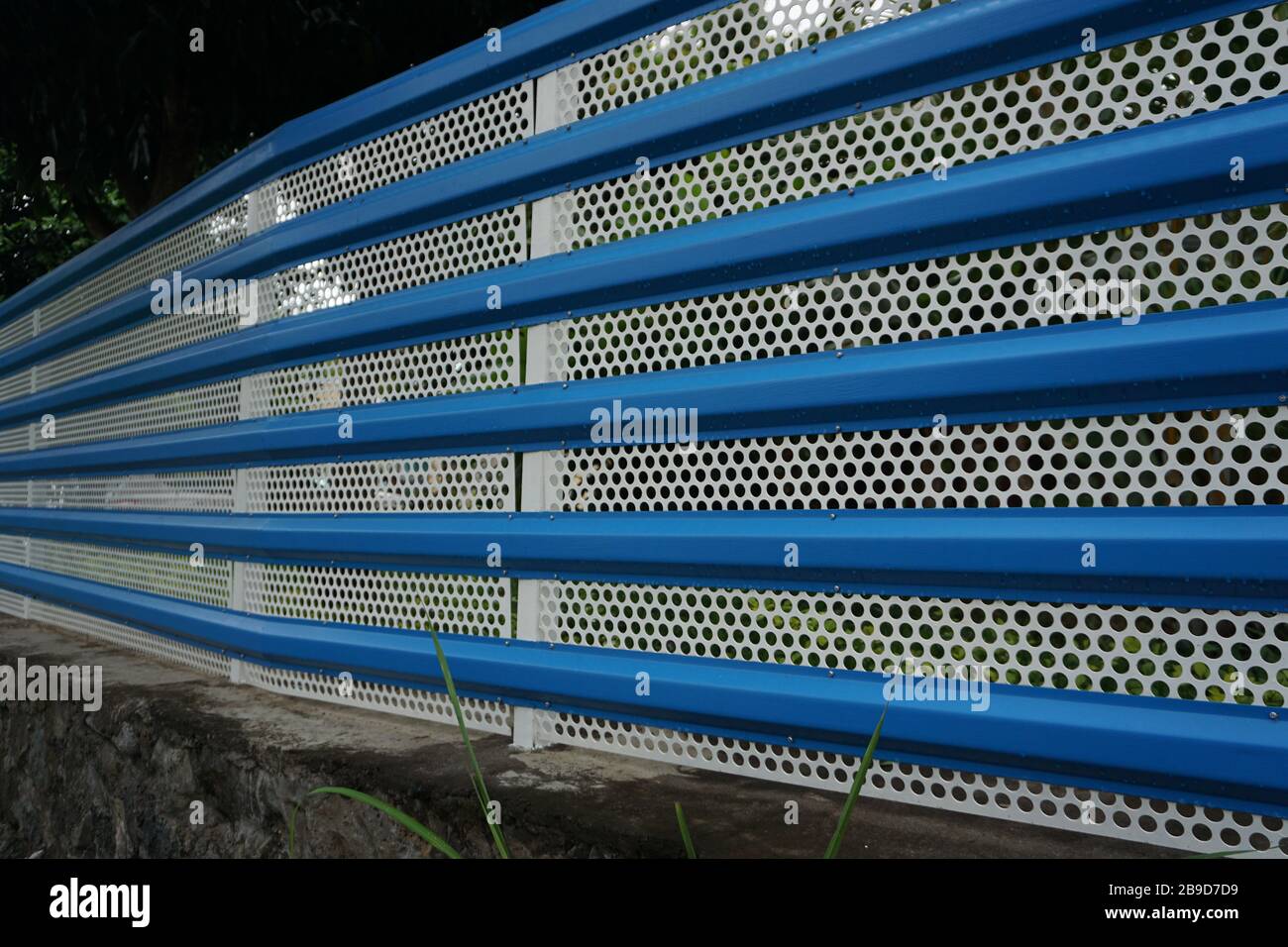 closeup of a blue and white metal fencing Stock Photo - Alamy