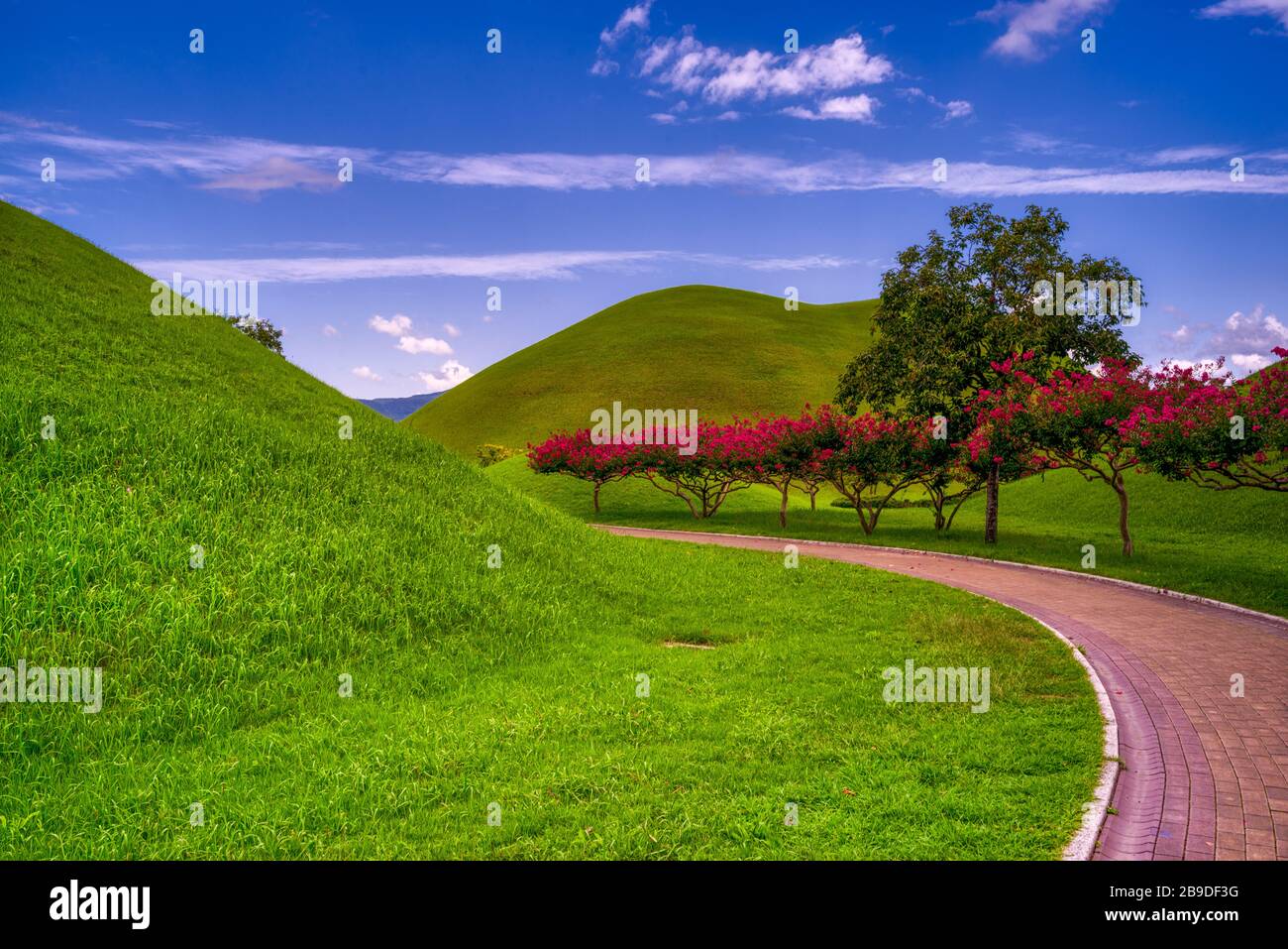 Vertical conceptual view of a hill and sky with clouds in the Gyeongju ...