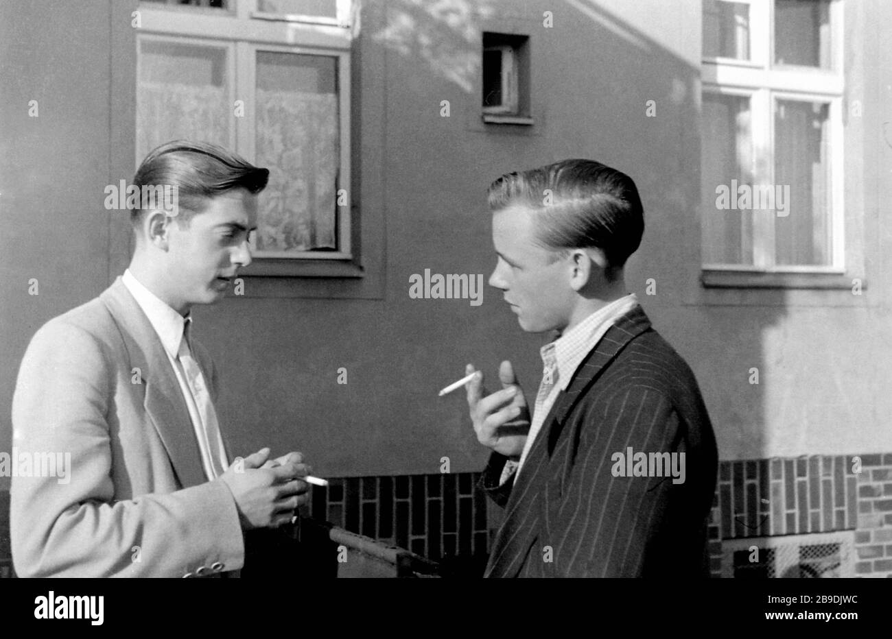 Two men smoking cigarettes hi-res stock photography and images - Alamy