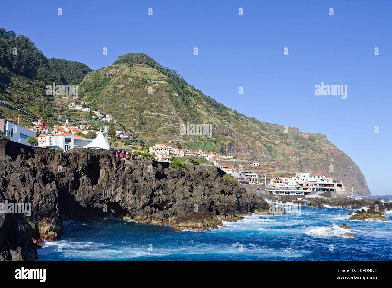 Panoramic view of the coastal village of Porto Moniz and his natural ...