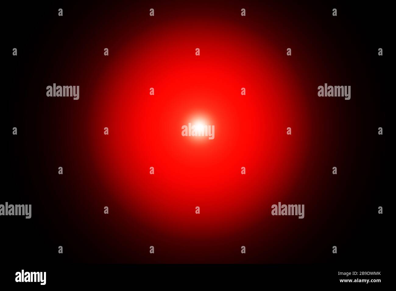 Glowing shiny objects in the dark. Red blurred spot Stock Photo - Alamy