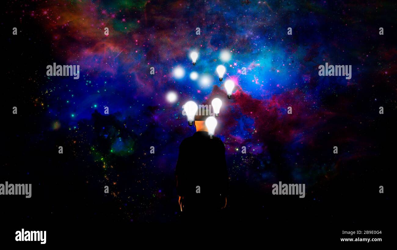 Man in suit with light bulbs around him stands in vivid universe Stock ...