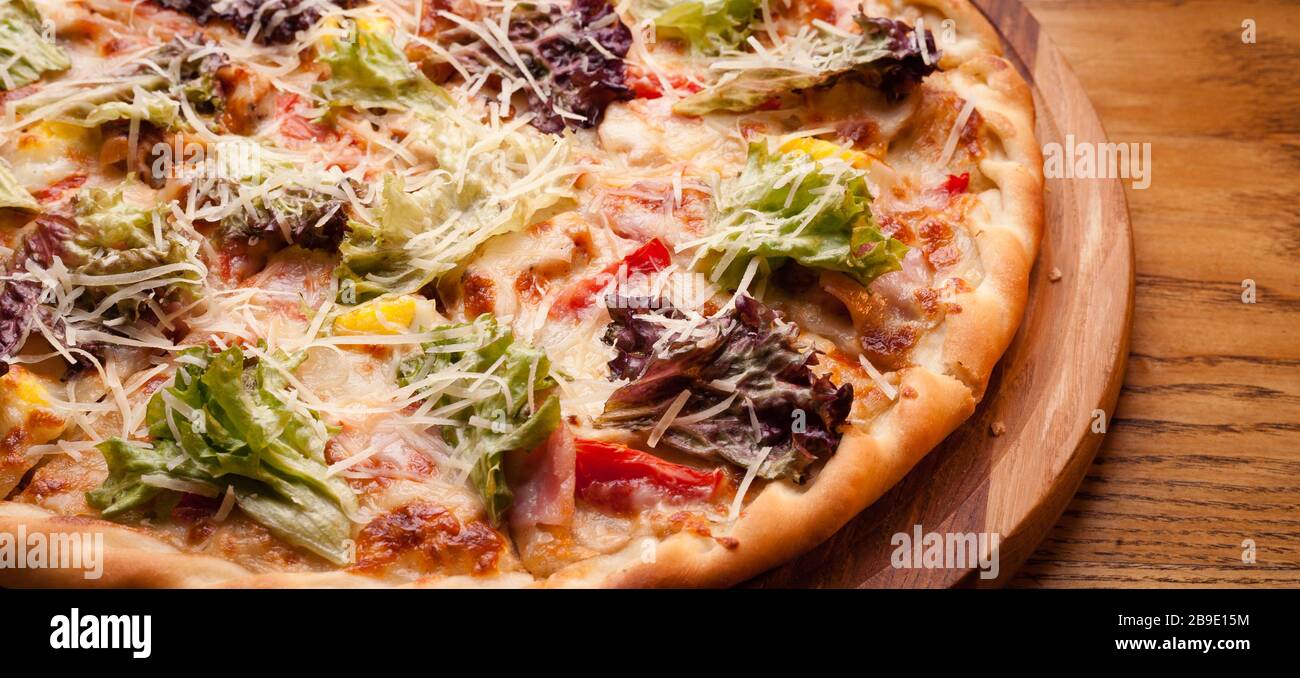 Ready-made appetizing pizza close-up. Stock photo pizza on a wooden ...