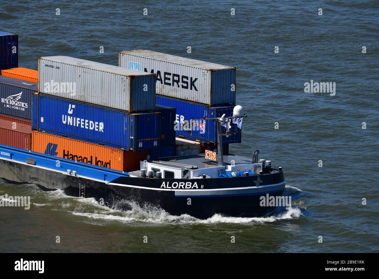 close up of container barge on the Maas River Rotterdam bringing their ...