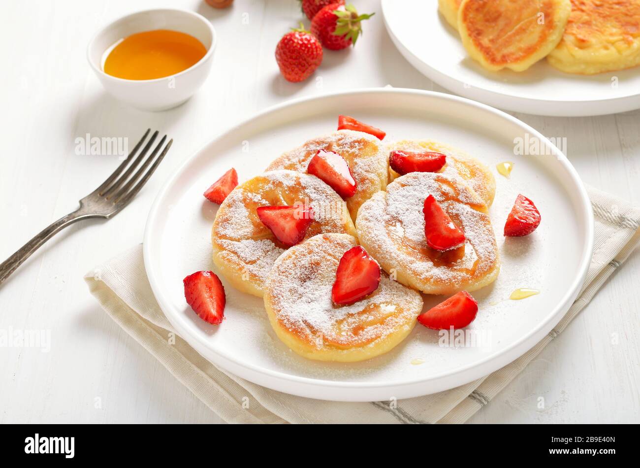 Homemade pancakes with cottage cheese and strawberry slices, healthy ...