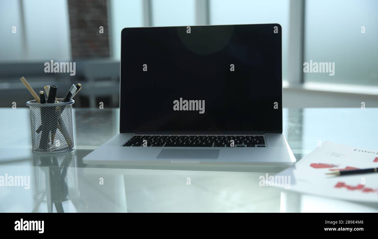 open laptop on glass table. photo with copy space Stock Photo - Alamy