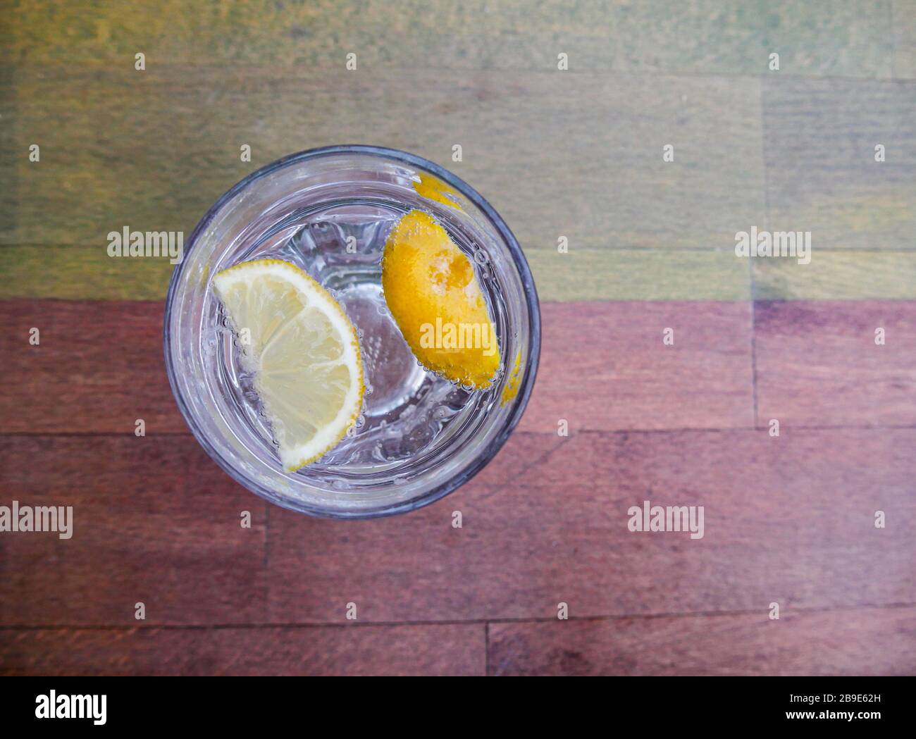 glass of sparkling water with lemon slices on table. drink and refreshment concept Stock Photo ...