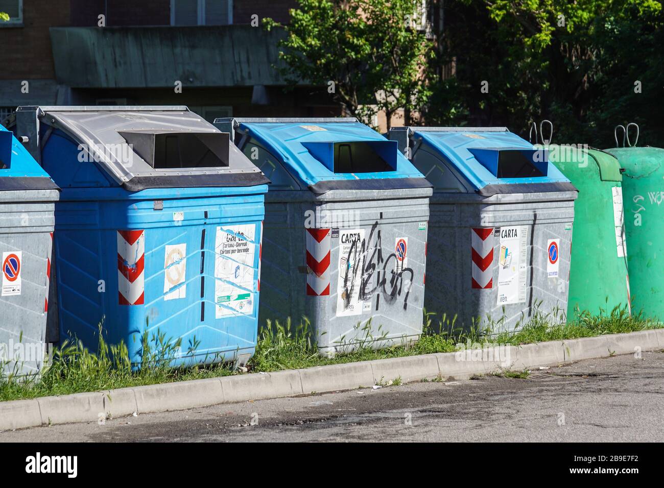 Italy , Rome , 17 March 2020 : Row of large green wheelie bins for ...