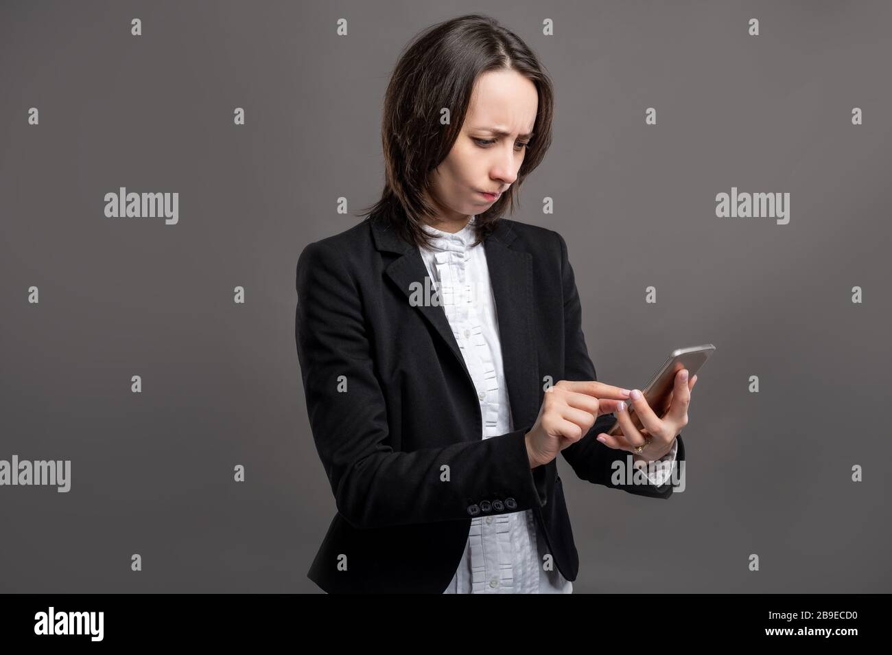 Portrait of wonderful young business woman wering black suit and shirt ...