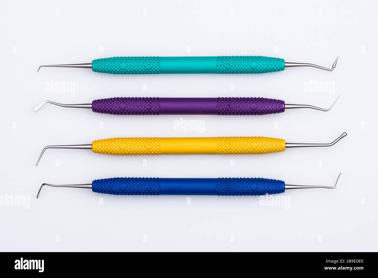 Dental tools on a white background - copy space Stock Photo - Alamy