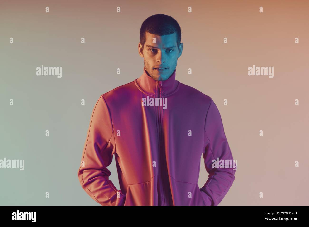 Close-up portrait of attractive male model. Retro wave portrait of a ...