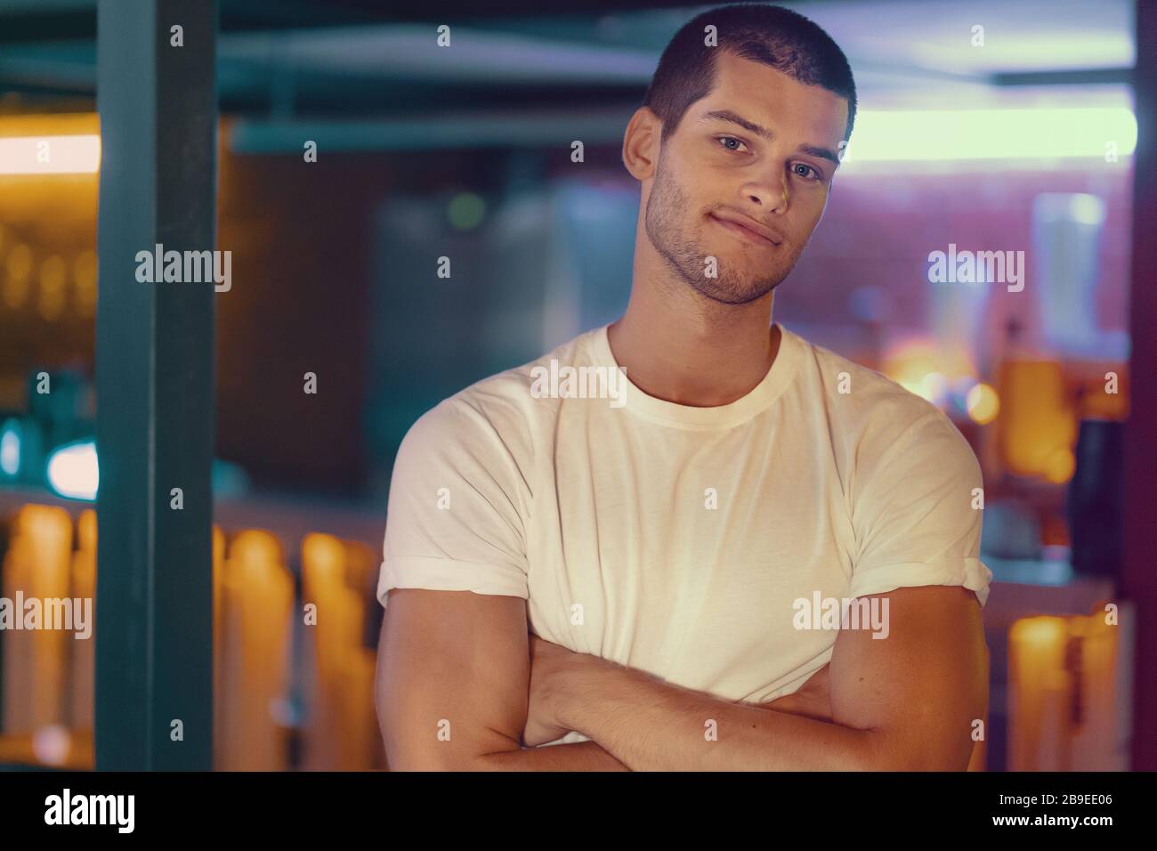 Close-up portrait of attractive male model. Retro wave portrait of a ...