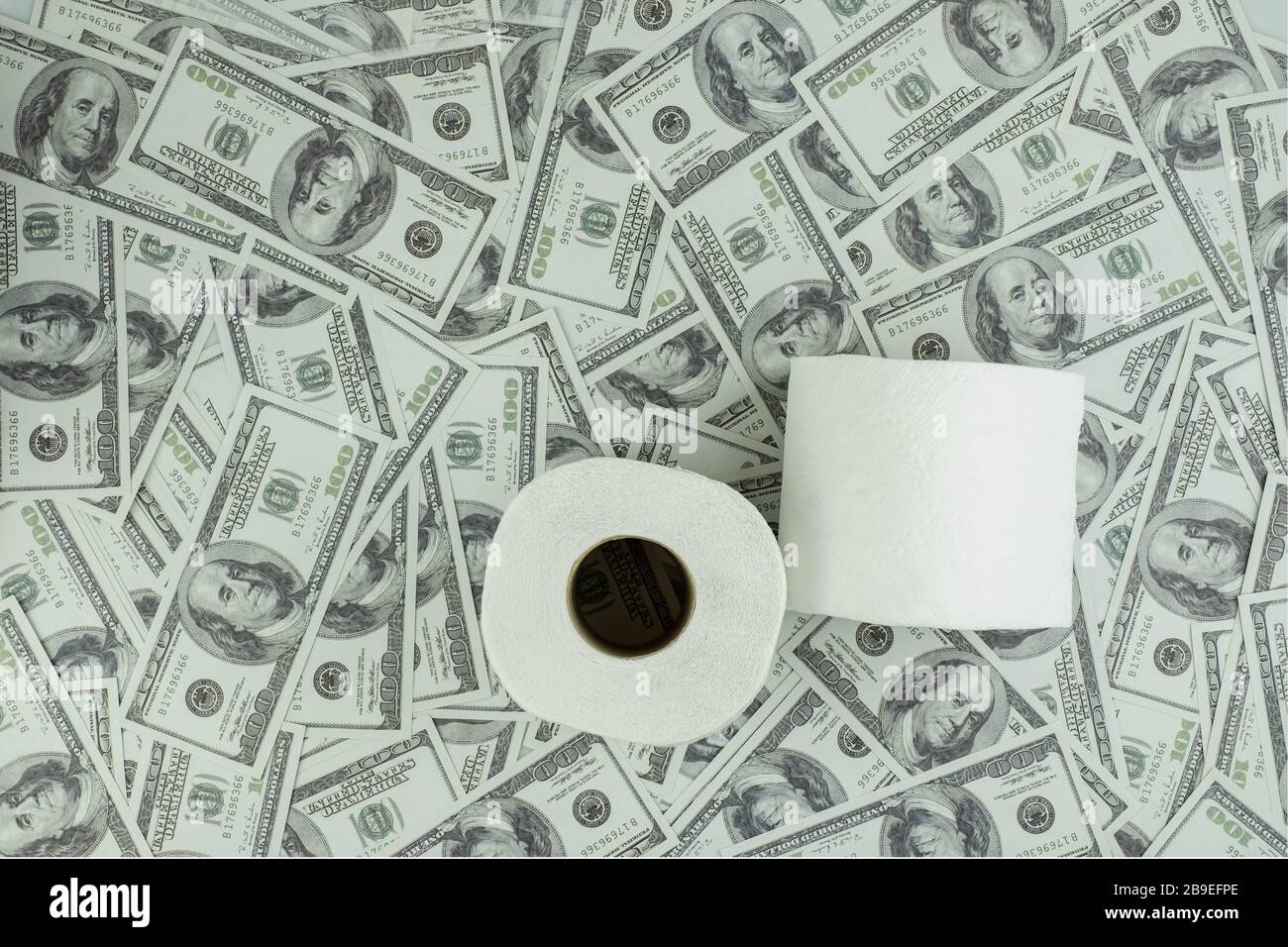 Toilet paper tissue and money of stack 100 US dollars banknote a lot of ...