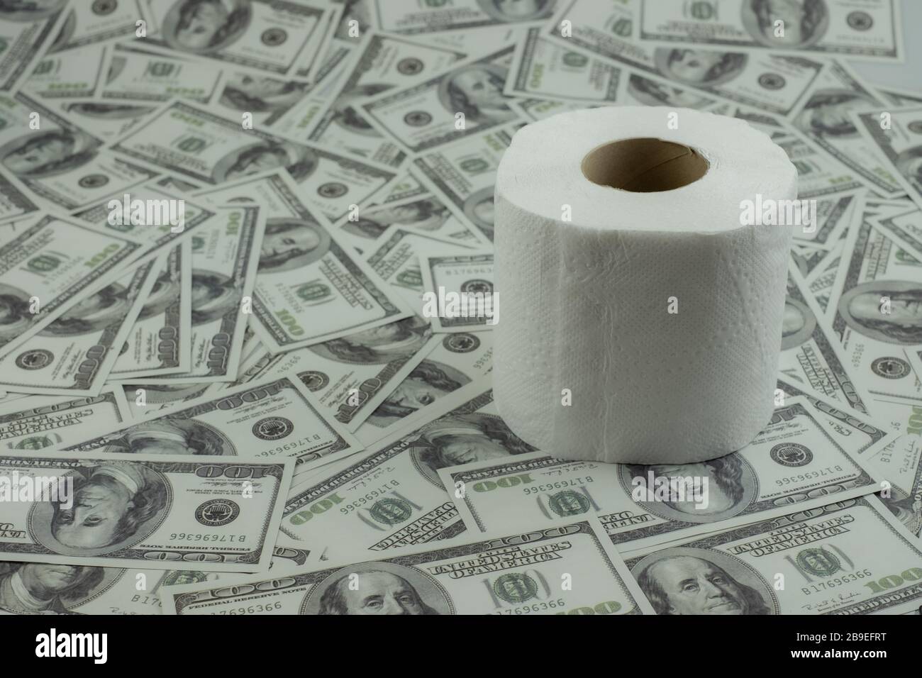 Toilet paper tissue and money of stack 100 US dollars banknote a lot of ...