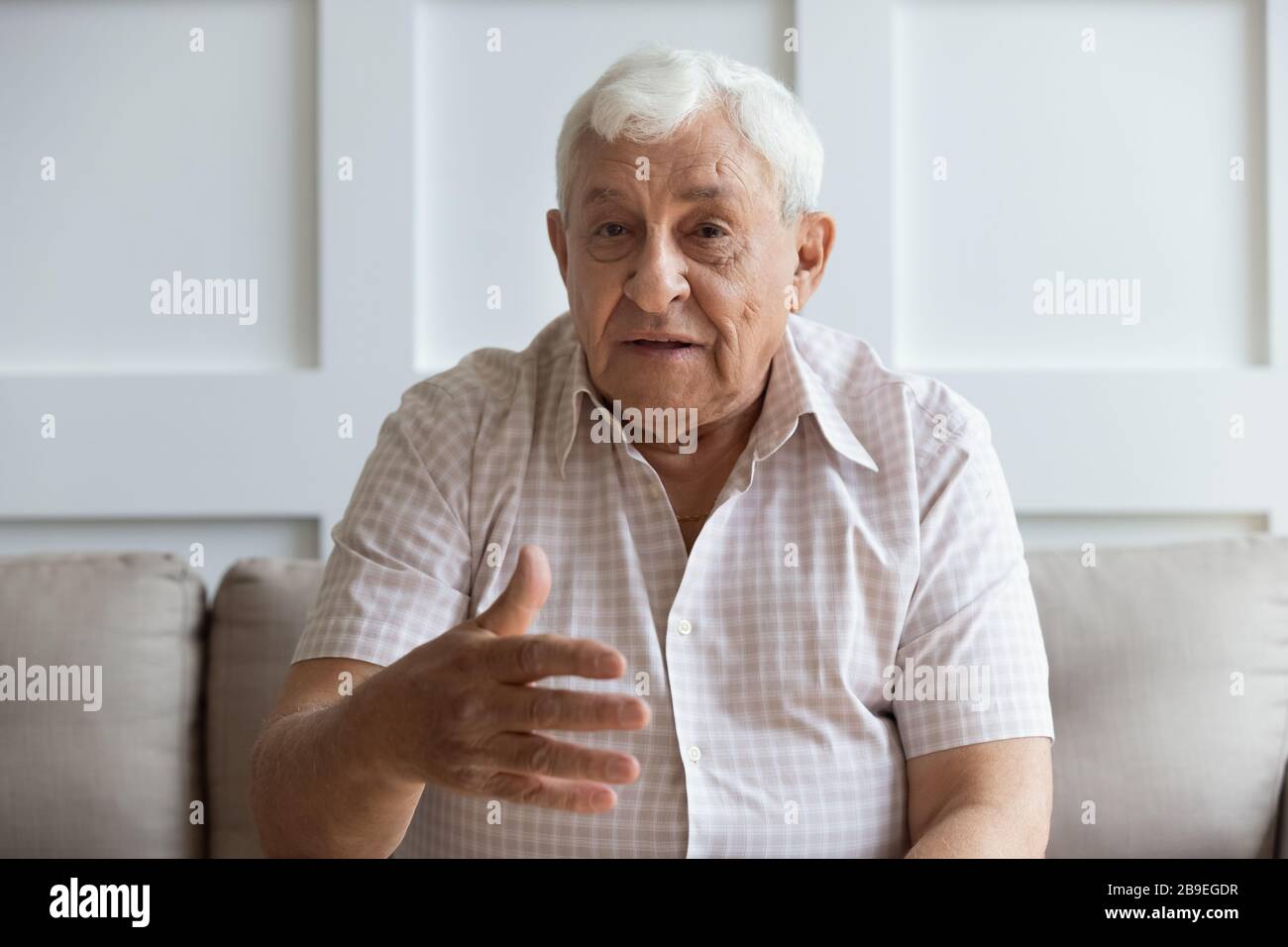 Head shot serious older man looking at camera and talking Stock Photo ...