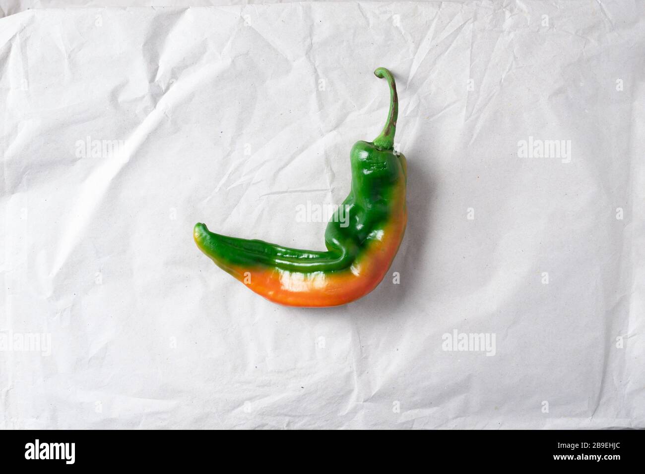 Ugly bell pepper on craft paper background. Concept of zero waste ...