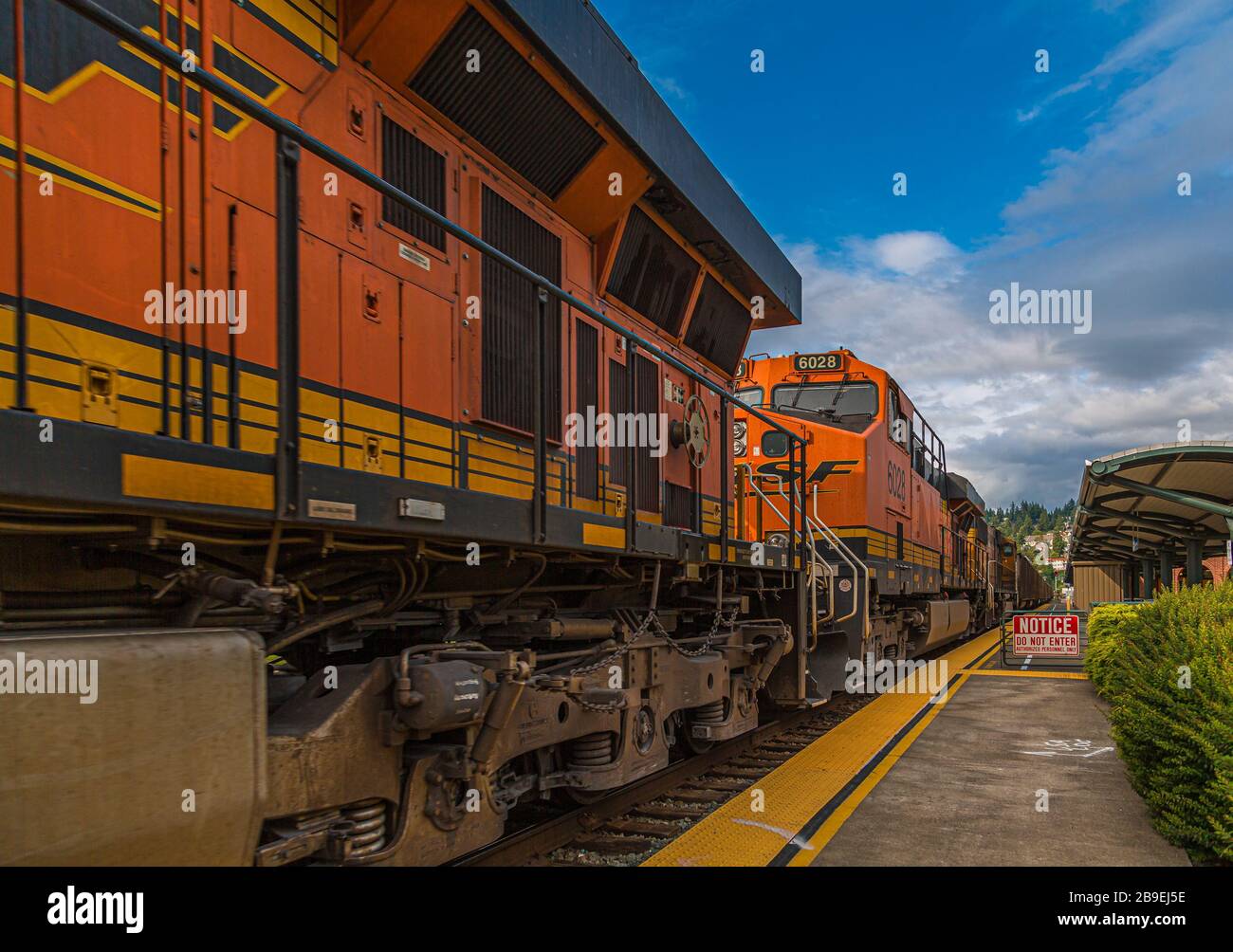 Freight Train Rolling Past Stock Photo - Alamy